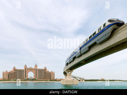 Monorail train approaching The Palm Atlantis luxury hotel on artificial ...