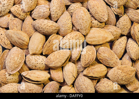 Almonds close-up background Stock Photo - Alamy