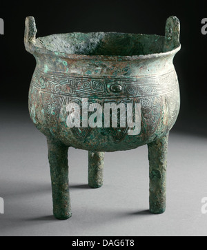 A ritual food cauldron (Ding) with intricate mask motifs, used in ...