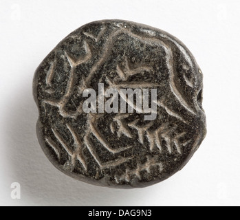 This ancient stamp features a gabled design with a rounded back. Made ...