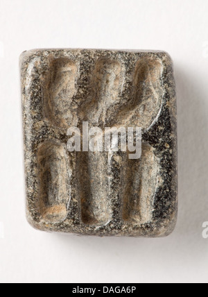 This tabloid stamp seal, an ancient tool used for imprinting designs or ...