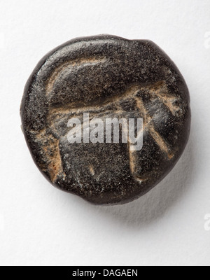 This ancient stamp seal features intricate carvings, likely used for ...