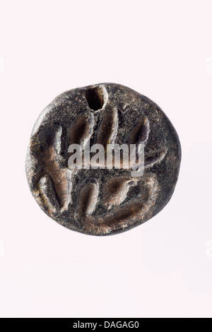 This ancient stamp seal, crafted in stone, features intricate designs ...