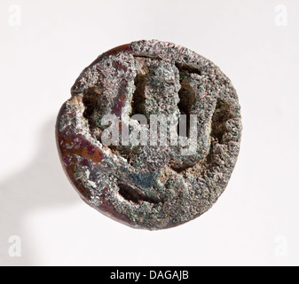 This ancient stamp seal features intricate design, used historically ...