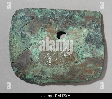 This ritual axe, a ceremonial object, features detailed craftsmanship ...