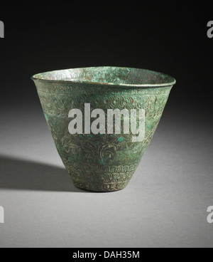 This beaker is a drinking vessel crafted from glass or ceramic, likely ...