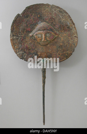 This disc-headed pin is a fine example of ancient adornment, crafted ...