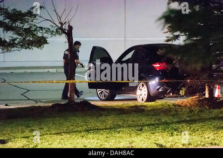 Vaughan, Canada. 12th July, 2013. York Regional Police officers comb ...