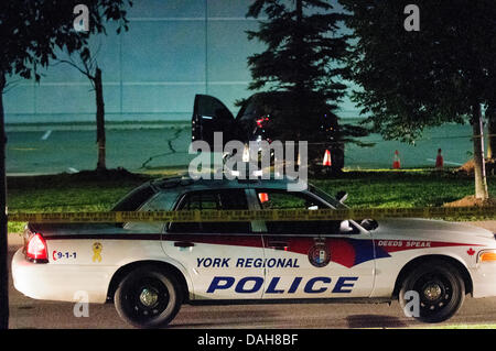Vaughan, Canada. 12th July, 2013. York Regional Police officers comb ...