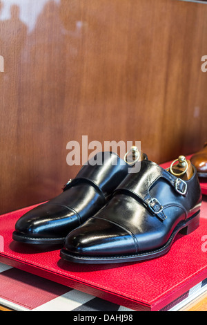 Men's feet in black shoes in the subway, Tokyo, Japan. With selective ...