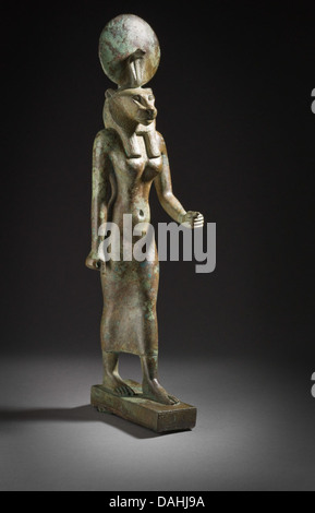 An ancient Egyptian artifact depicting the goddess Bastet, shown with a ...