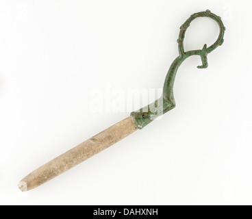 This whetstone socket is an ancient tool used for sharpening. Its ...