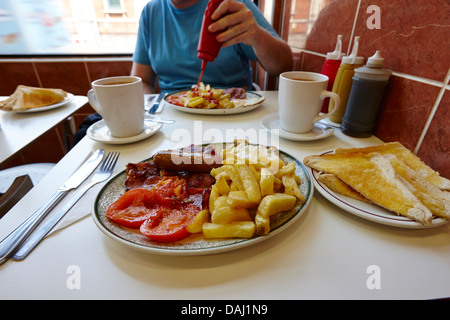 A 'greasy spoon' fried full english breakfast - bacon, egg, sausage ...
