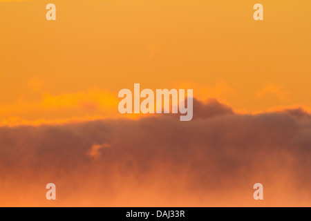 Beautiful sky during an orange sunset Stock Photo - Alamy