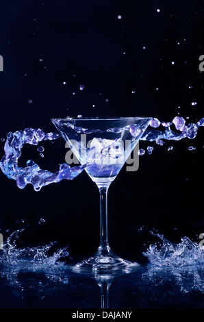 red splashing cocktail on black Stock Photo - Alamy