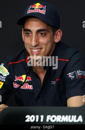 Swiss Formula One driver Sebastien Buemi of Toro Rosso (R) and his ...