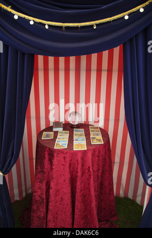 Psychic with Crystal Ball and tarot cards in Red Velvet Tent Stock ...