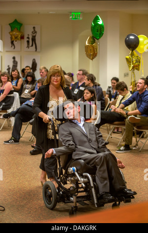 A wheelchair-bound Adult Transition Program (ATP) student is welcomed ...