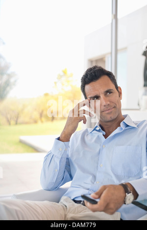 Selective focus of cellphone in hands of crop happy pregnant African ...