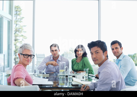 Business people sitting in meeting Stock Photo - Alamy