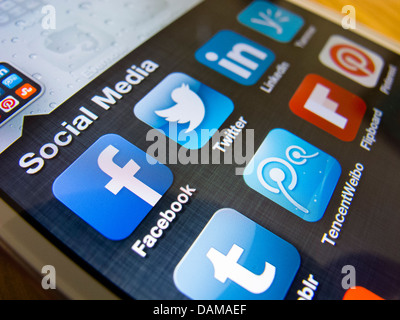 A smartphone screen with many social media and essential applications ...