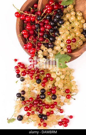 Bowl with tasty red currants and different berries on light background ...