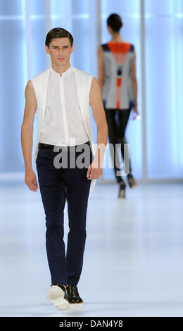 Models present creations of Hugo show offsite the Mercedes-Benz Fashion ...