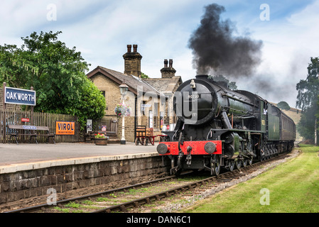 WD Class 2-8-0 (8F) steam loco No. 90733 at Oakworth station the scene ...