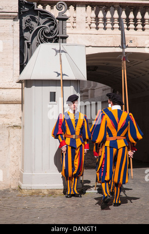 Papal Swiss Guard stand guard in traditional uniform with pike in Stock ...