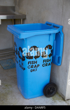 Plastic bins for disposal of fish waste in the coastal town of Exmouth ...