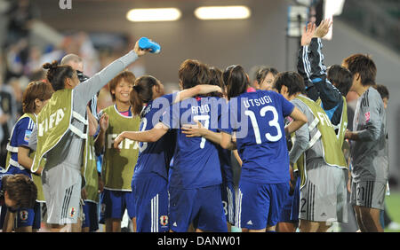 Team Japan celebrate after their victory against Team France during ...