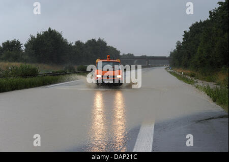 A vehicle of the motorway maintenance drives at Autobahn A73, shut ...