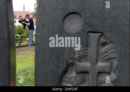 A camera man films the spot, where the grave of Adolf Hitler's Deputy ...