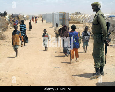 Refugees walk through the Somalian refugee camp Ifo during the visit of ...