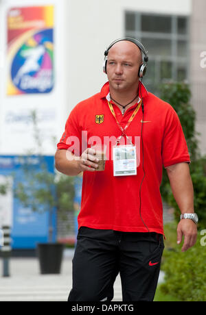 German hammer thrower Markus Esser poses in front of the athlete's ...