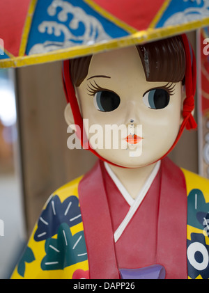 Okinawan woman in traditional clothing at Ryukyu Mura a historical ...