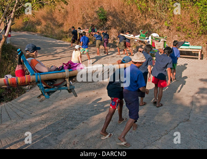 Tourist carried in a sedan chair at Ajanta Buddhist Caves in India ...