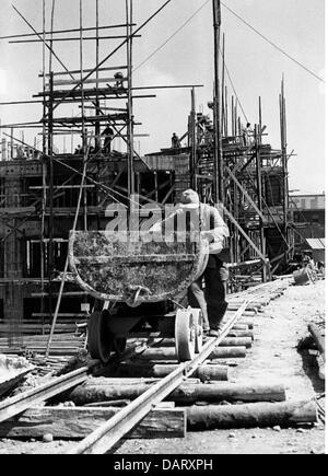 1950s, a post-war construction site, concrete foundations of new office ...
