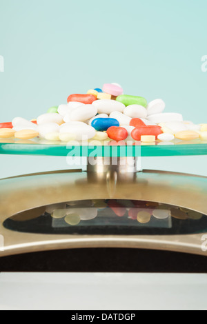 Close-up of scale with precious drugs on weights, isolated on white ...