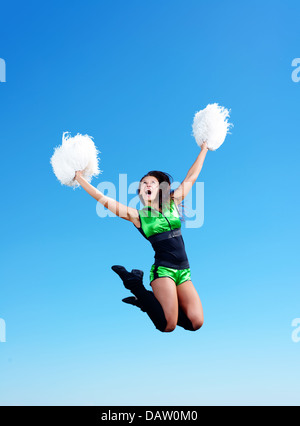 cheerleader girl jumping Stock Photo - Alamy