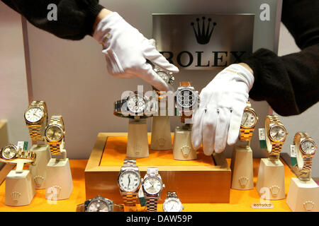 An employee with white gloves arranges the top-end luxury watches of ...