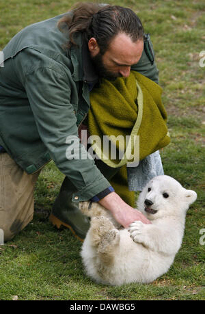 Polar bear cub 'Knut' and his foster father Thomas Doerflein welcome ...