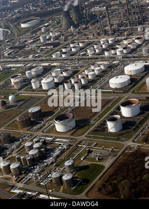 Huge oil tanks are pictured on the premises of the Shell refinery in ...