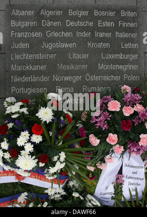 Memorial plaque and wreaths at the site of the former Irish internment ...
