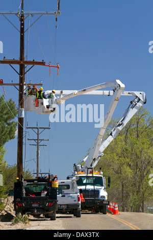 Idaho Power installing electric power lines using cherry pickers near ...