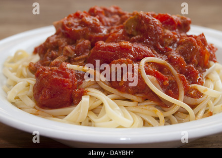 Italian cuisine: pasta with tomato juice and tuna Stock Photo - Alamy