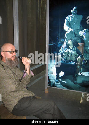 Russian provoking artist Oleg Kulik explains one of his works in Moscow, Russia, 26 June 2007 ...