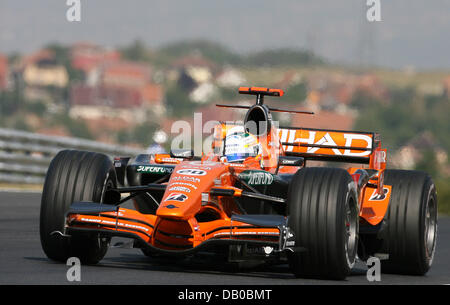 German Formula One rookie Adrian Sutil (L) of Spyker F1 Team and his ...