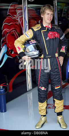 German Formula One rookie Sebastian Vettel of Scuderia Toro Rosso poses ...
