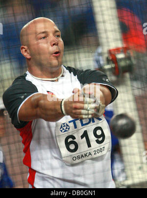 German hammer thrower Markus Esser shows a pendant of the Germanic god ...